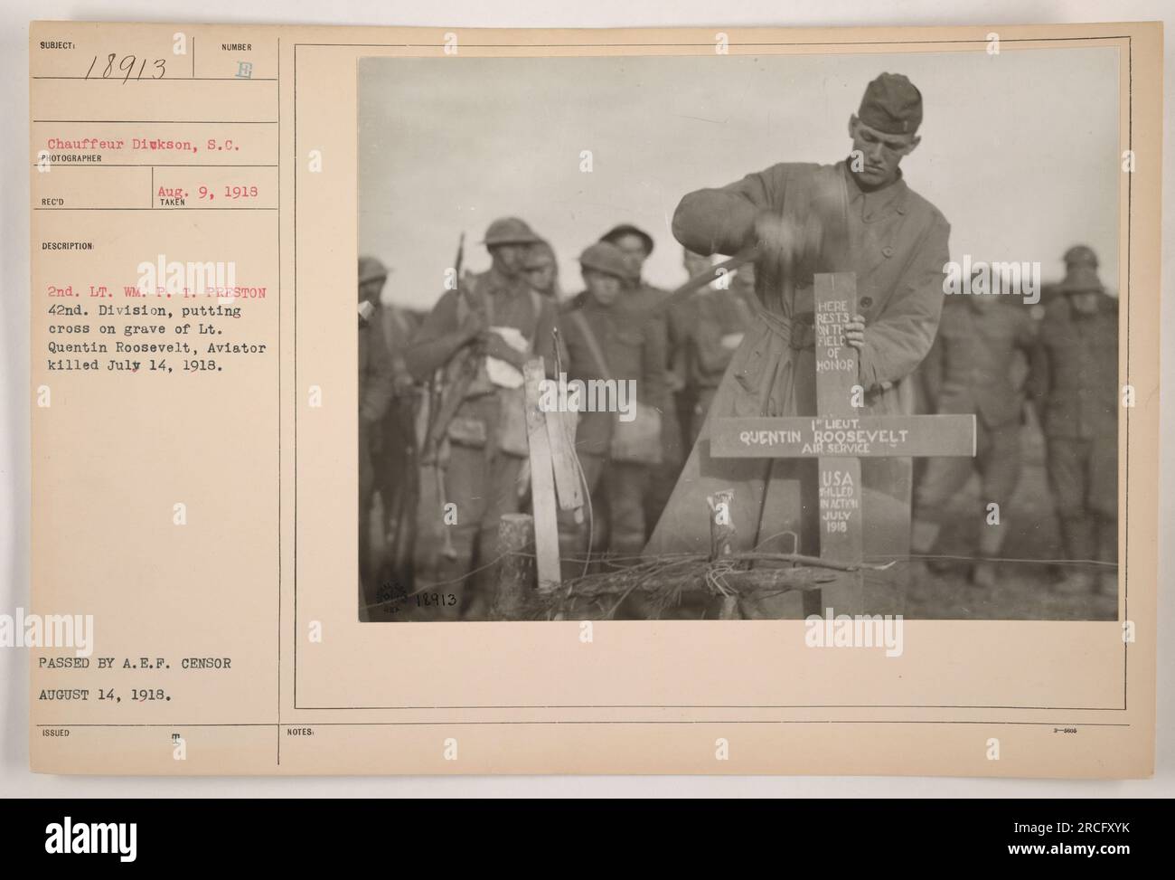 Second Lieutenant William P.T. Preston of the 42nd Division, seen here placing a cross on the ...