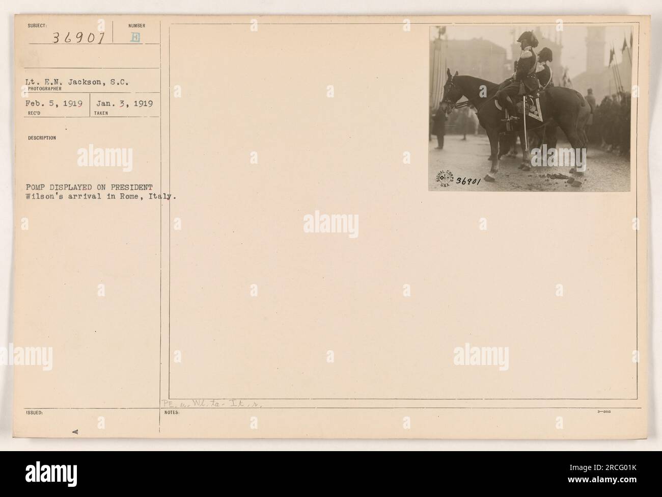 Soldiers of the American military stand in formation, holding guns, as ...