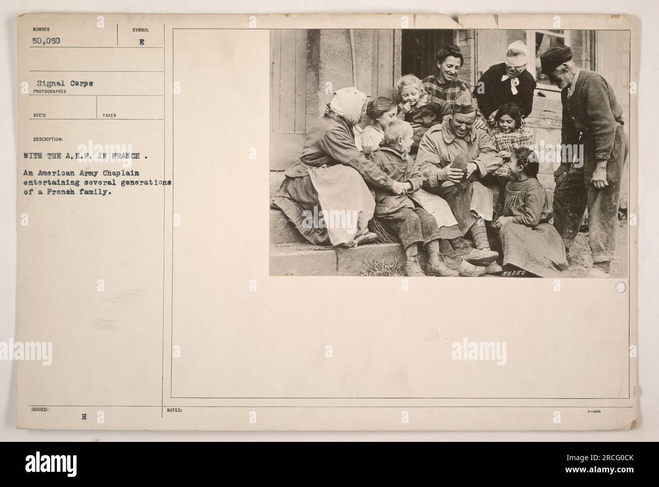 An American Army Chaplain brings joy to a French family during World ...