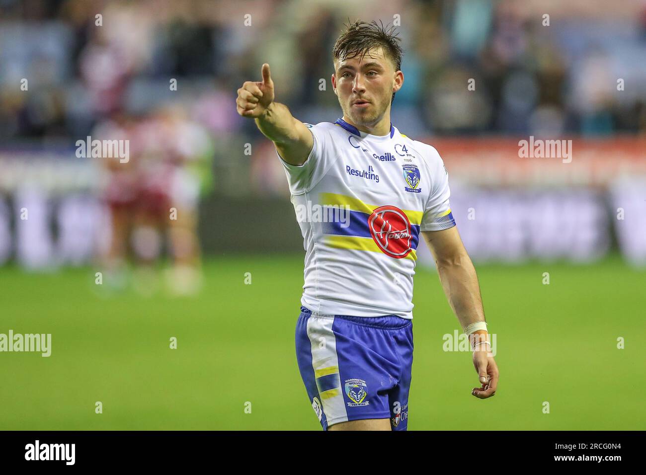 Adam Holroyd #26 of Warrington Wolves applauds the travelling fans ...