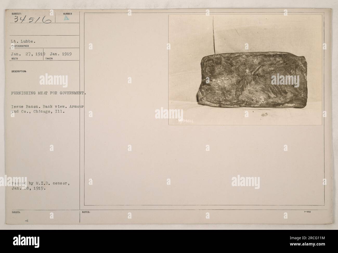 Soldier preparing food rations, labelled "Issue Bacon," for the ...