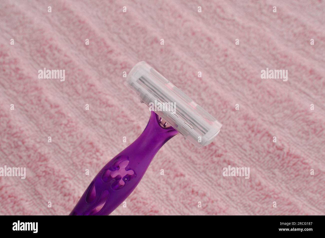 An elegant image of a female shaver on a smooth surface, conveying the ...