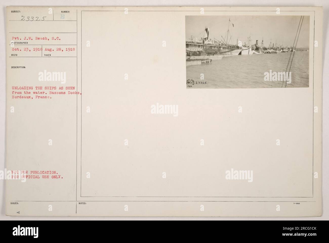 Pvt. J.W. Beach from the Signal Corps unloading ships at Bassons Docks ...