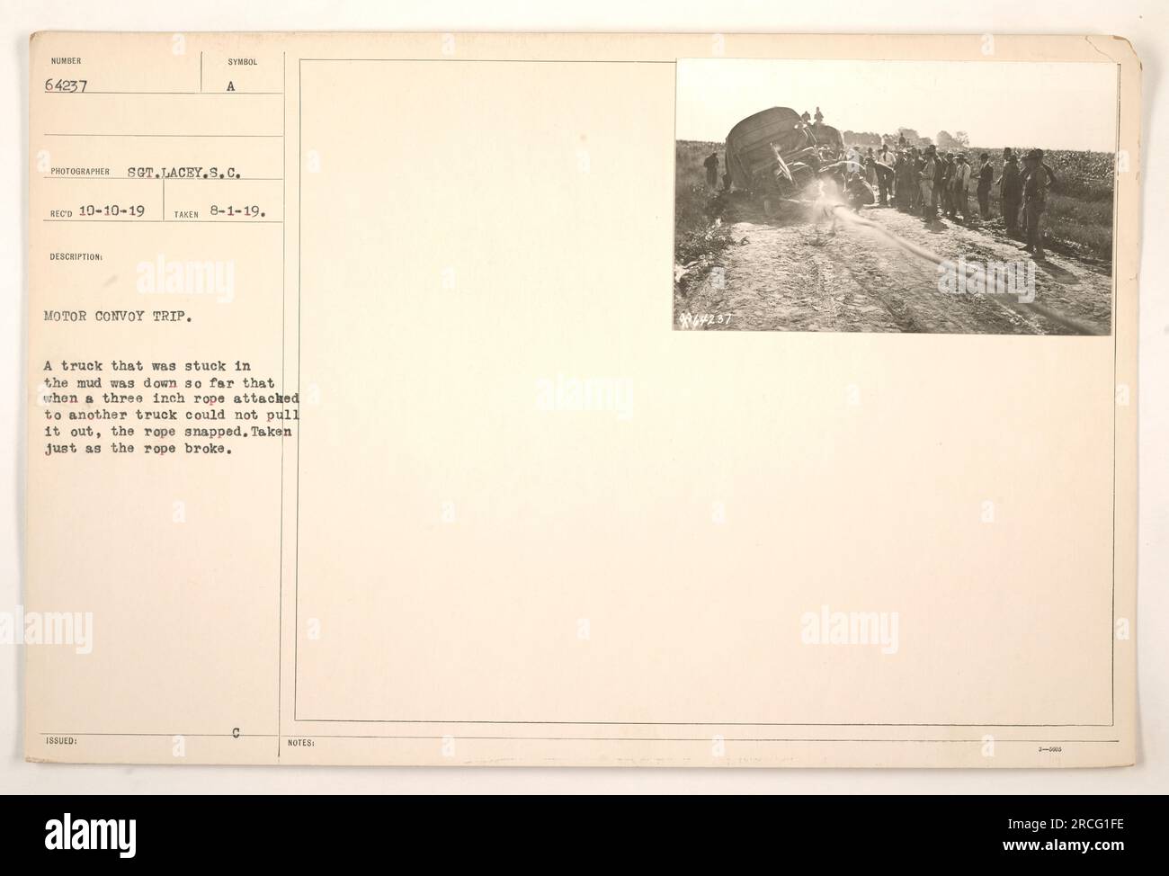 A truck gets stuck in the mud during a motor convoy trip. Despite ...