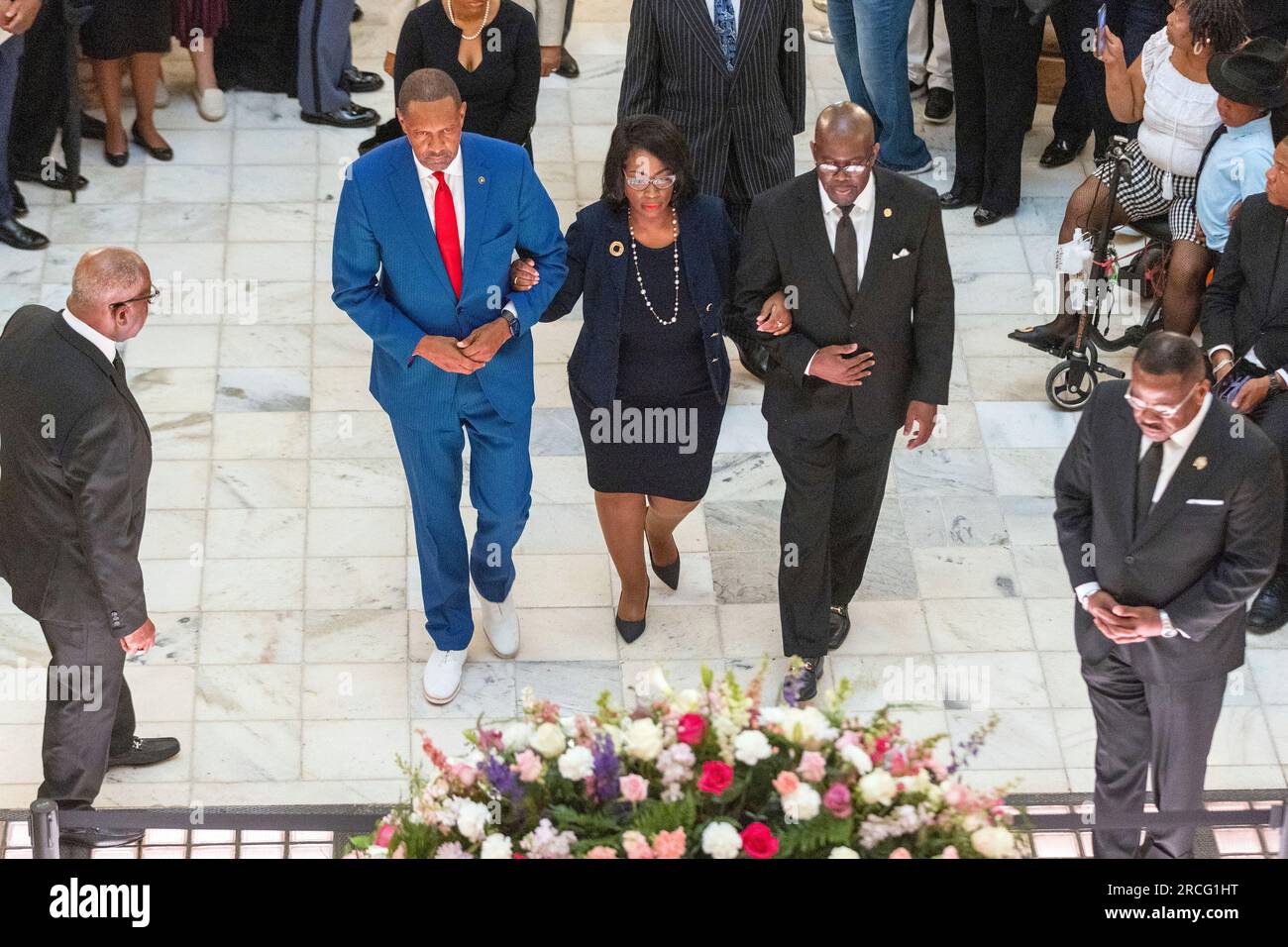 Angela Christine Farris Watkins, center, Christine King Farris' daughter, enters the ceremony ...