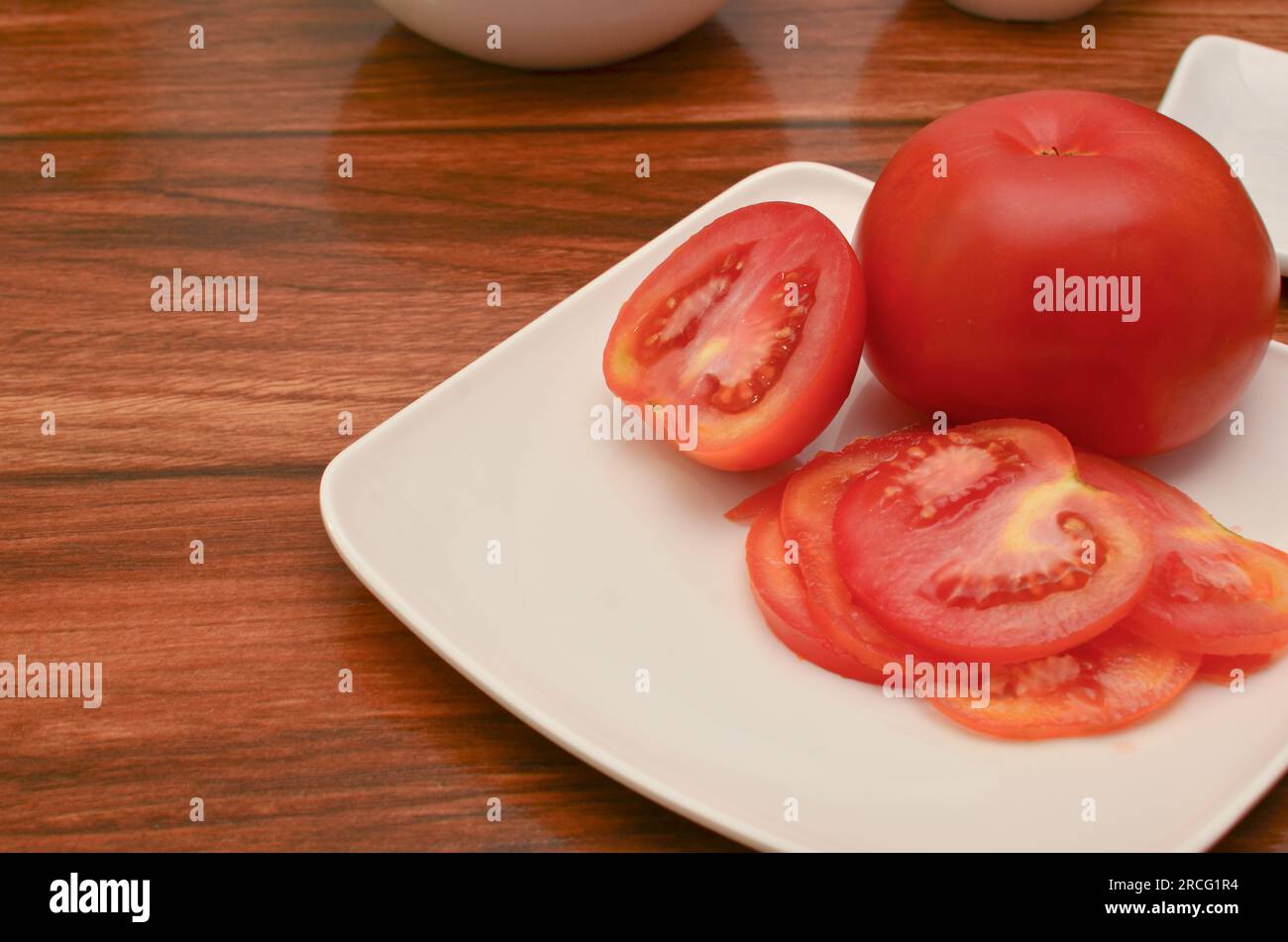 Close-up of juicy red tomatoes, transmitting freshness and quality to ...
