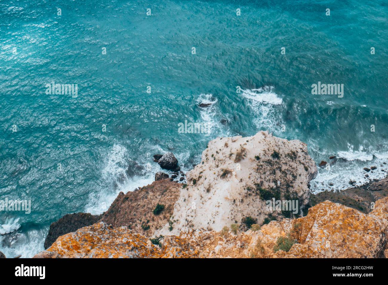 Gentle waves and sea foam from a tropical sea splash Stock Photo - Alamy