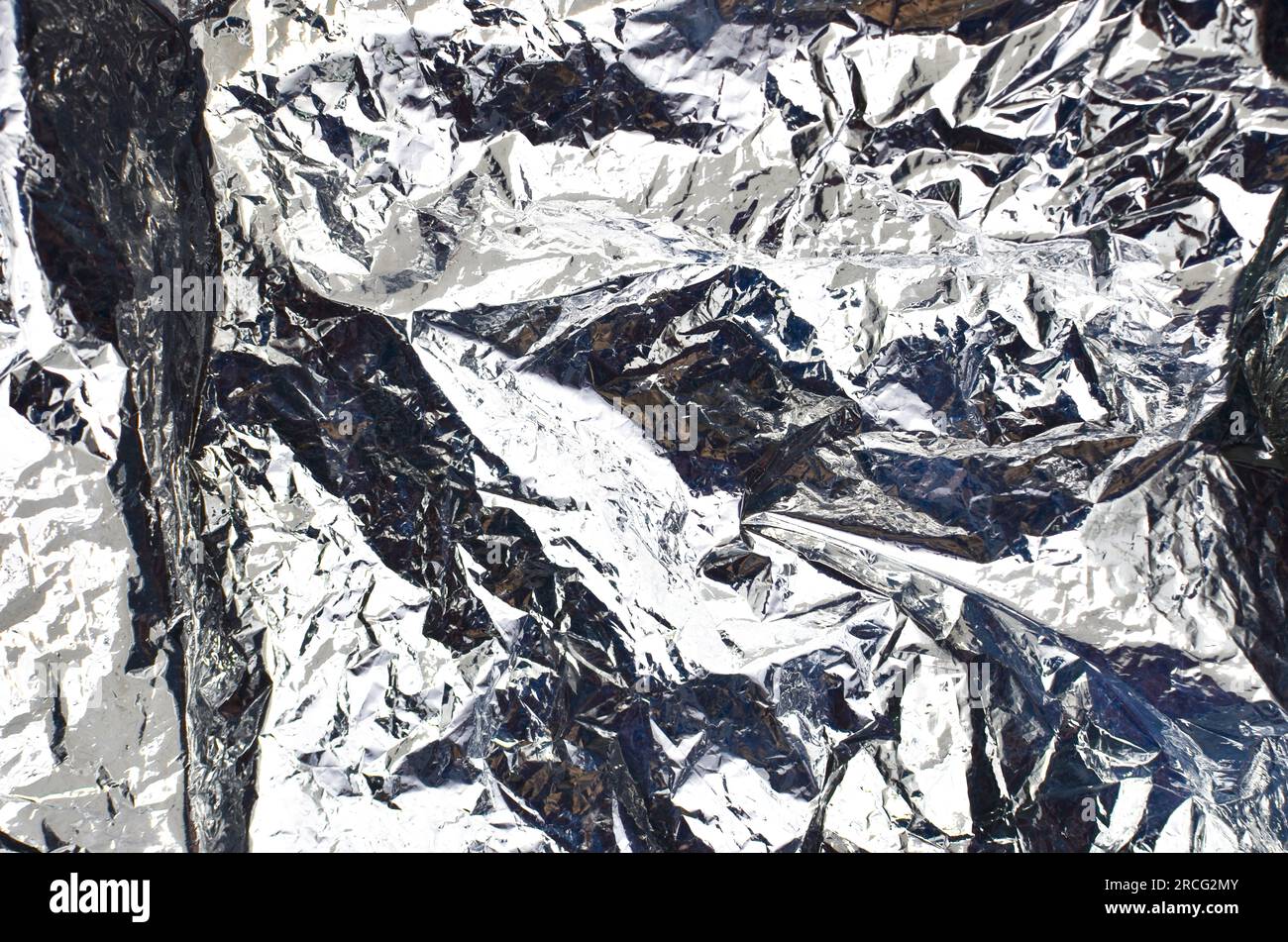 Smooth, silvery texture in a foil close-up, perfect for conveying ...