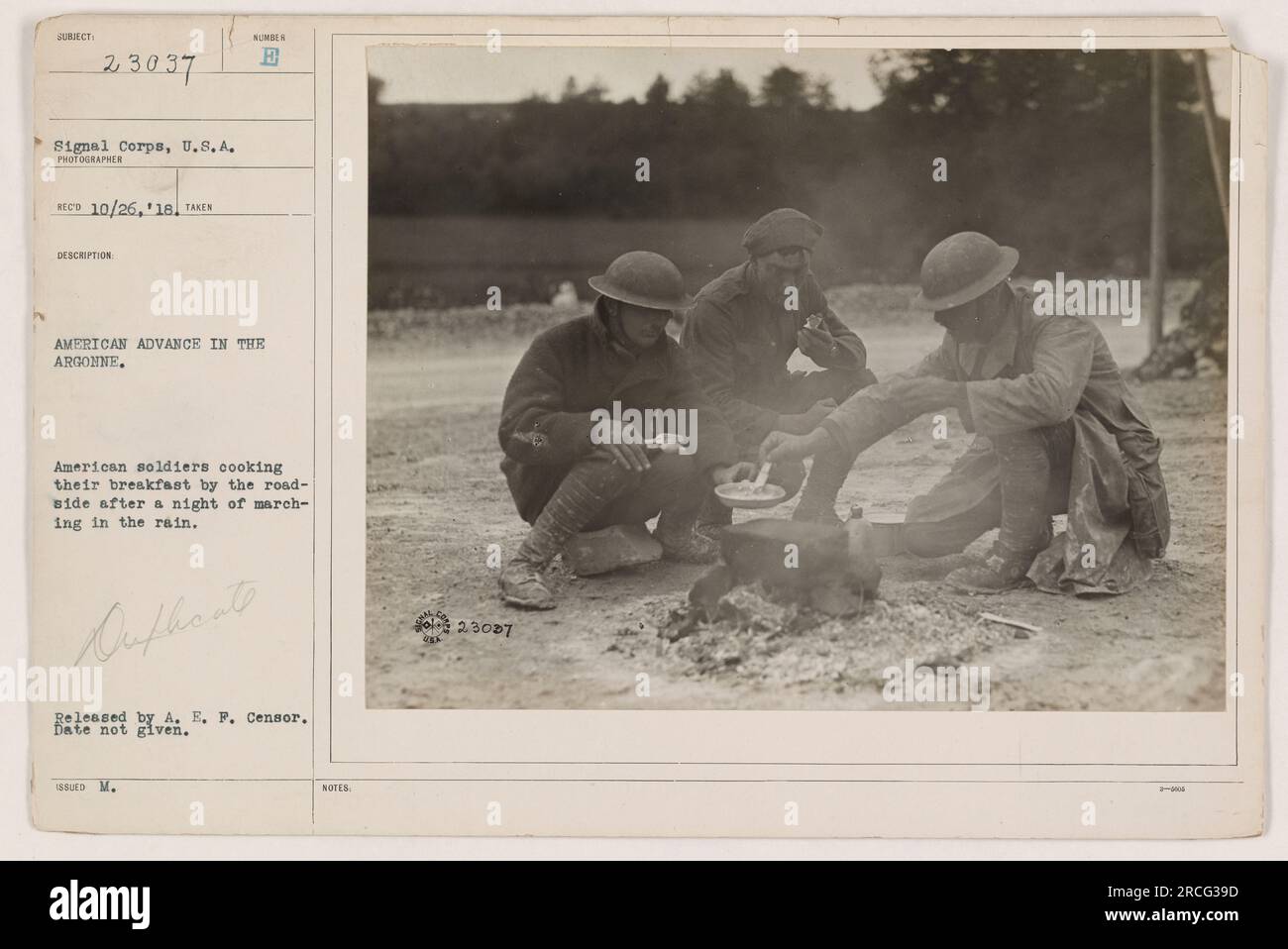 American soldiers cook breakfast by the roadside after a night of ...