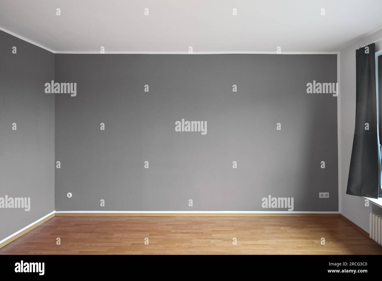 Small empty living room with gray painted walls and wood parquet in an ...
