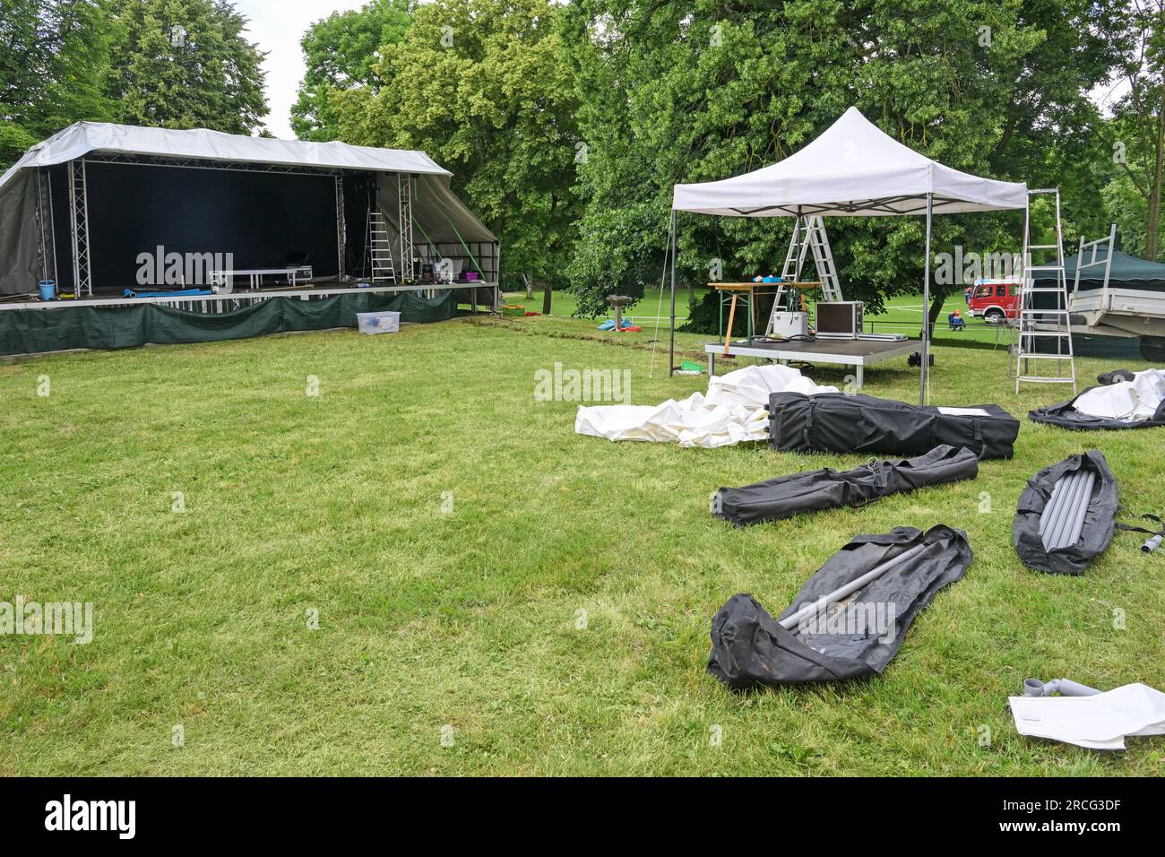 Open air stage, pavilion for the sound system, tent poles and canvas in ...