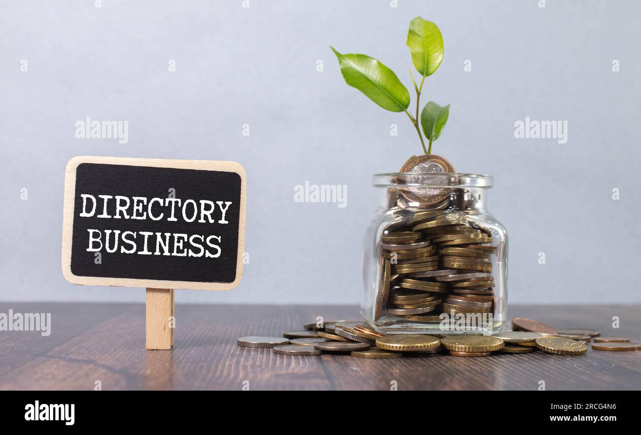 Business concept. Notebook with text DIRECTORY BUSINESS on pink paper ...