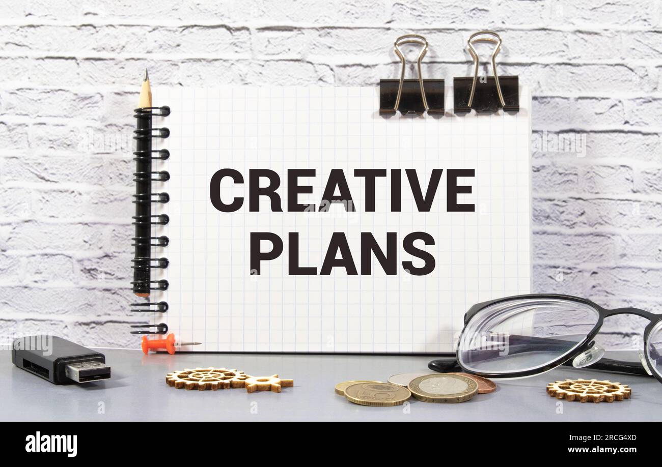 Business continuity plan text on notepad with glasses, pen and laptop ...