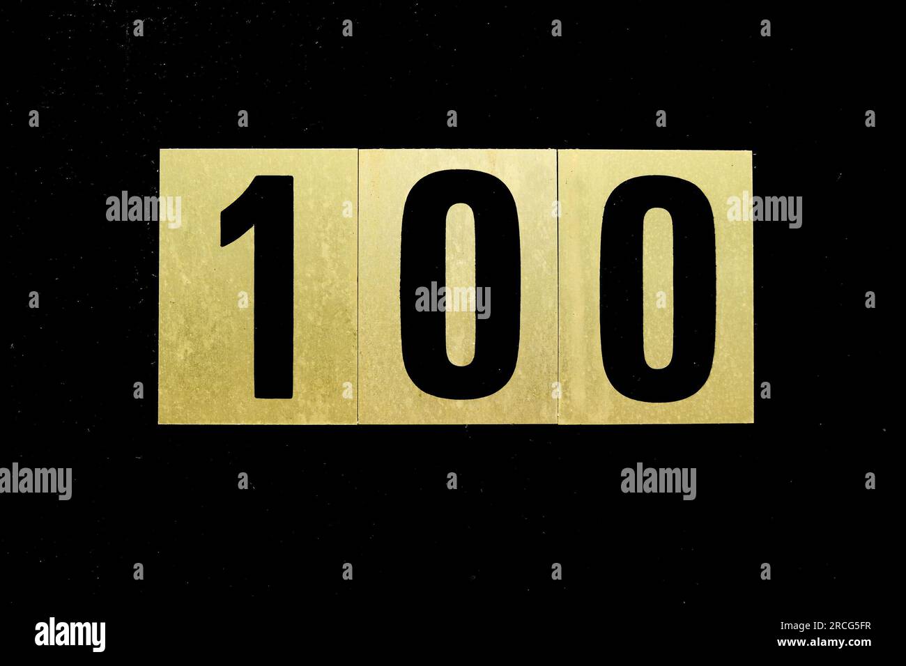 Number 100, one hundred, digits one zero zero, on black background ...
