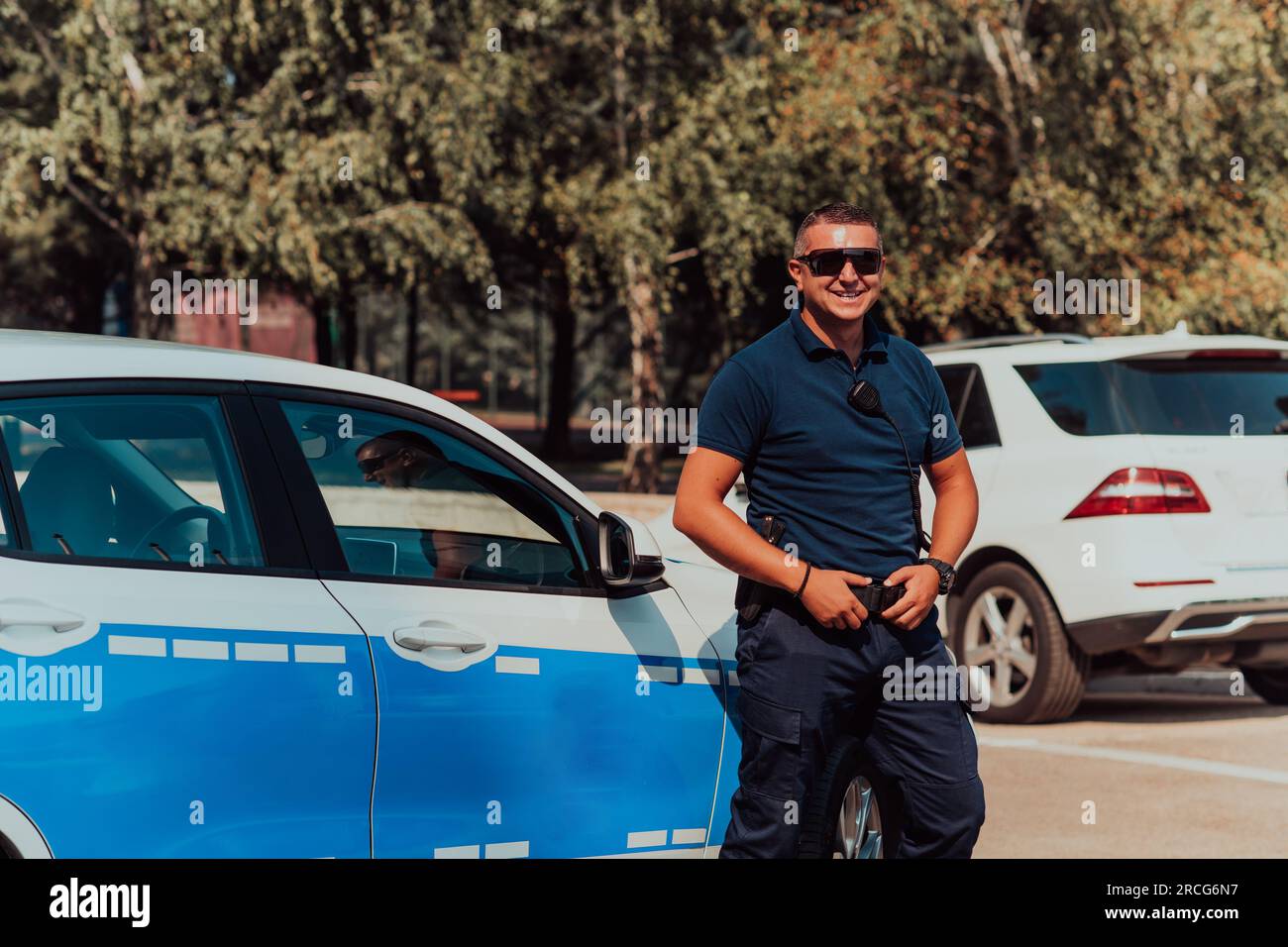 A policeofficer patrols the city. A police officer with sunglasses ...