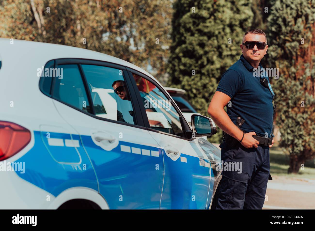 A policeofficer patrols the city. A police officer with sunglasses ...
