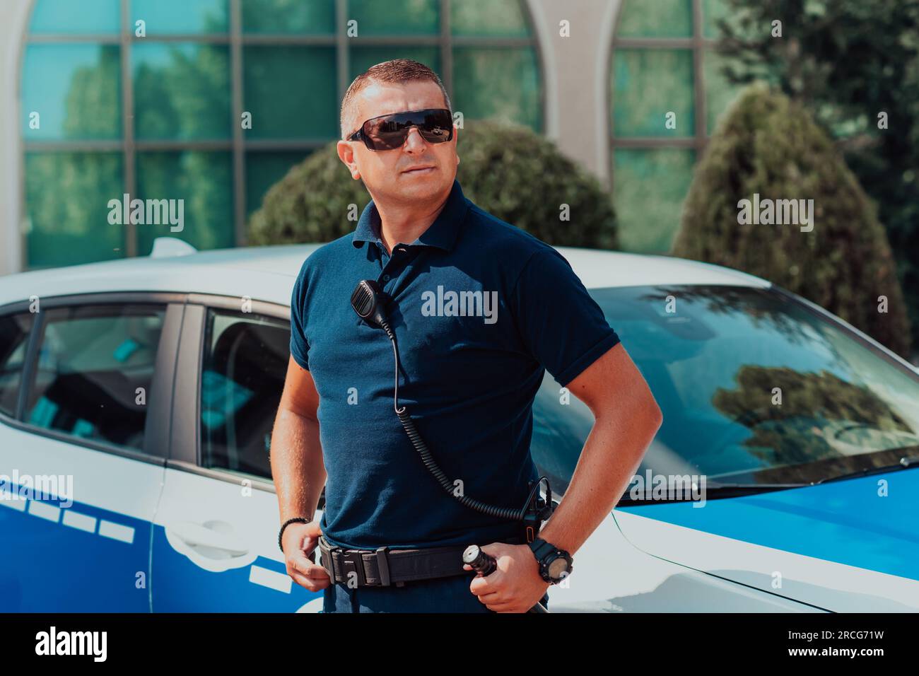 A policeofficer patrols the city. A police officer with sunglasses ...