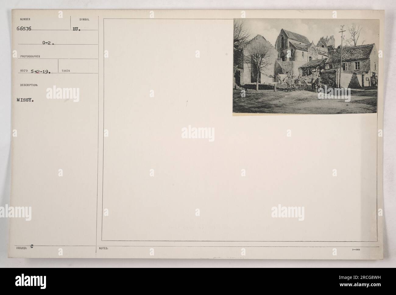 American soldiers entrenched in a muddy field during World War One. The ...