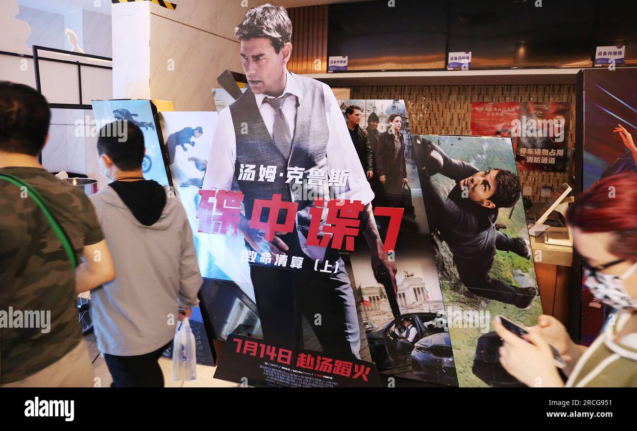 SHANGHAI, CHINA - JULY 14, 2023 - Fans pass a poster of the Super Agent ...