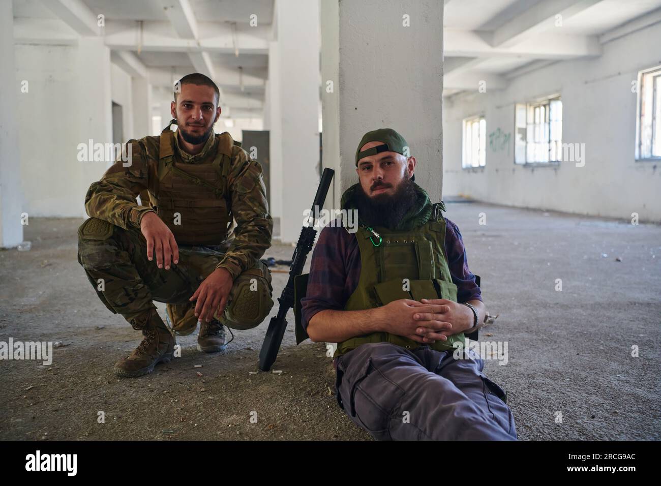 Group of soldiers discusses military tactics while situated in an ...