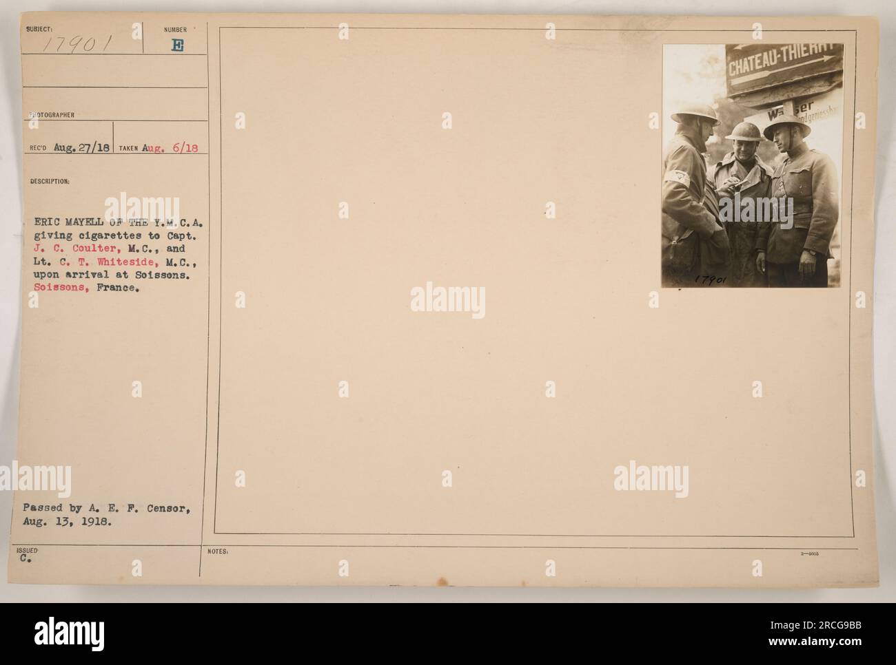 YMCA representative, Eric Mayell, is seen giving cigarettes to Captain ...