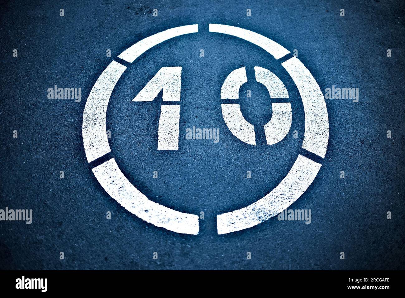 10, elegant number ten, a white circle on a dark blue surface, vignette ...