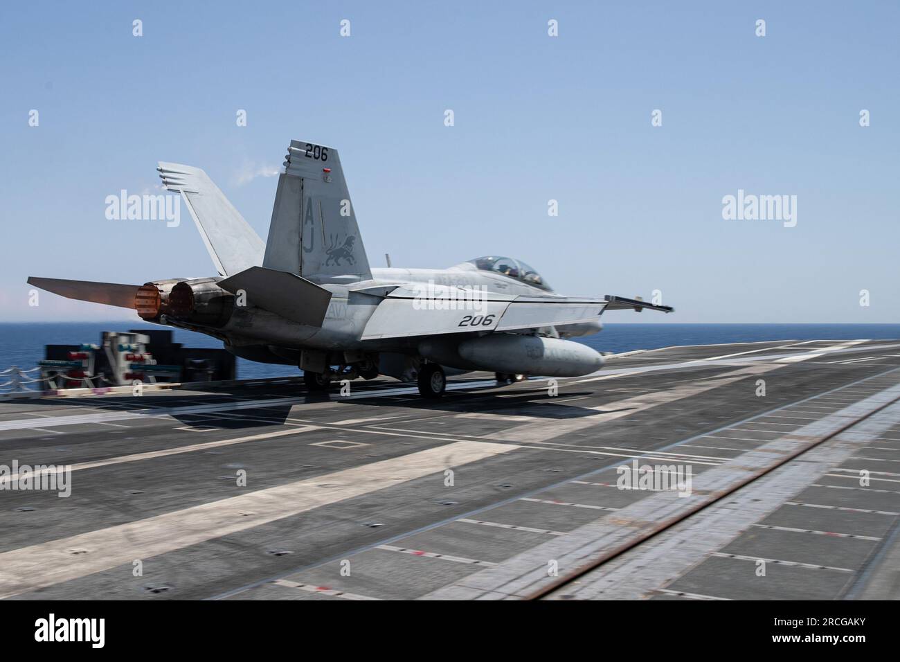 Capt. Dan Catlin, right, commanding officer of Carrier Air Wing (CVW) 8 ...