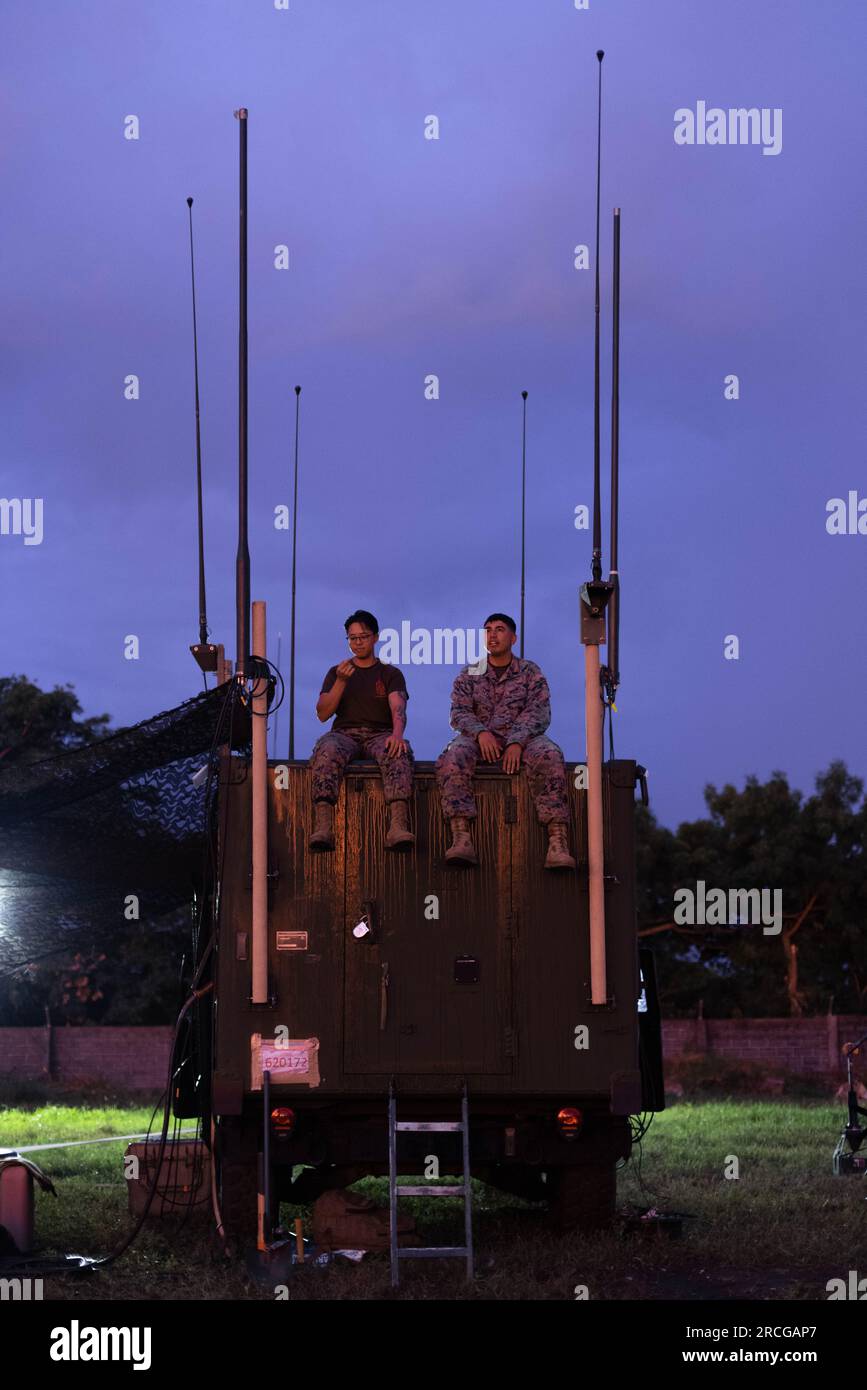 U.S. Marines with Marine Air Control Squadron 4 watch the sun set ...
