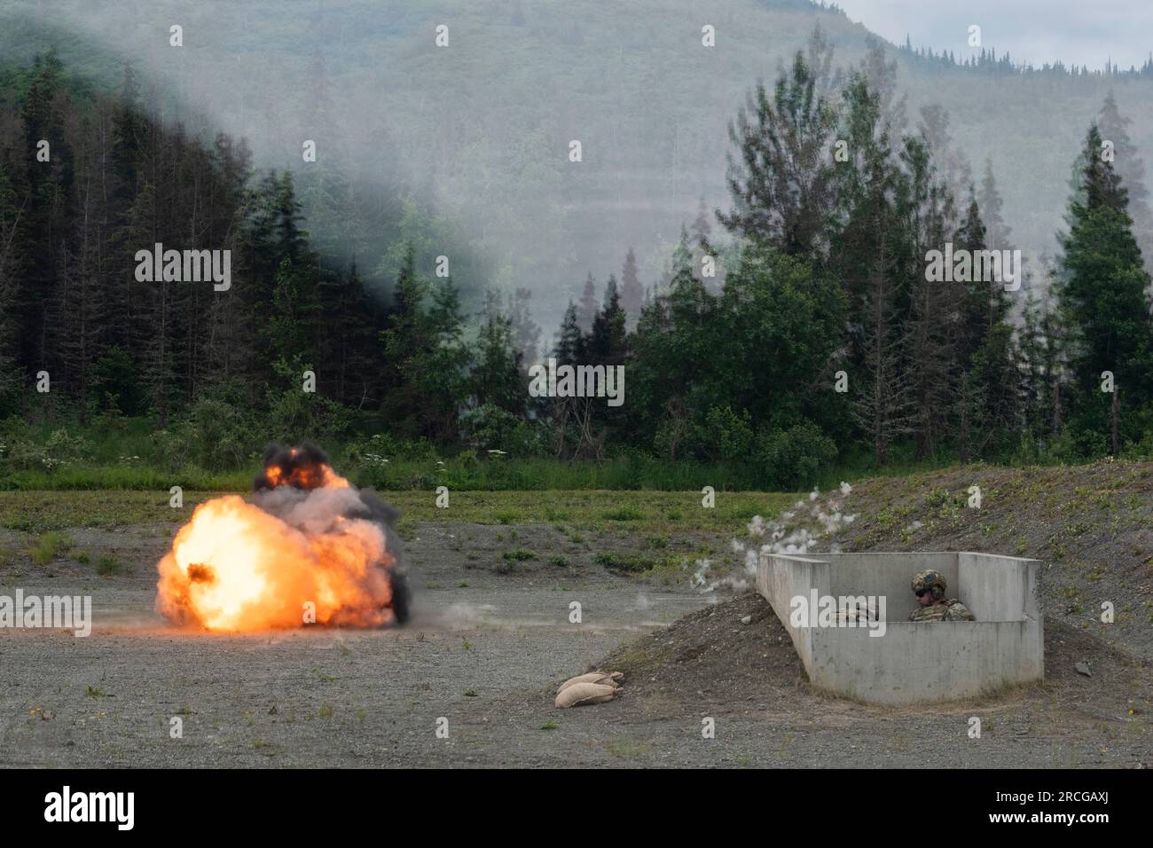 Army National Guard Soldiers take cover as a M18 Claymore mine explodes ...