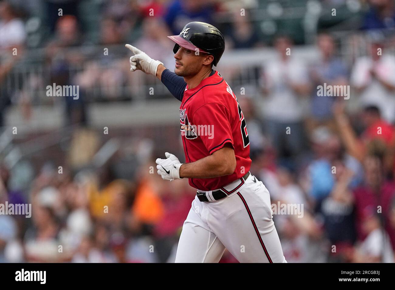 Atlanta Braves' Matt Olson gestures as he runs the bases after hitting ...