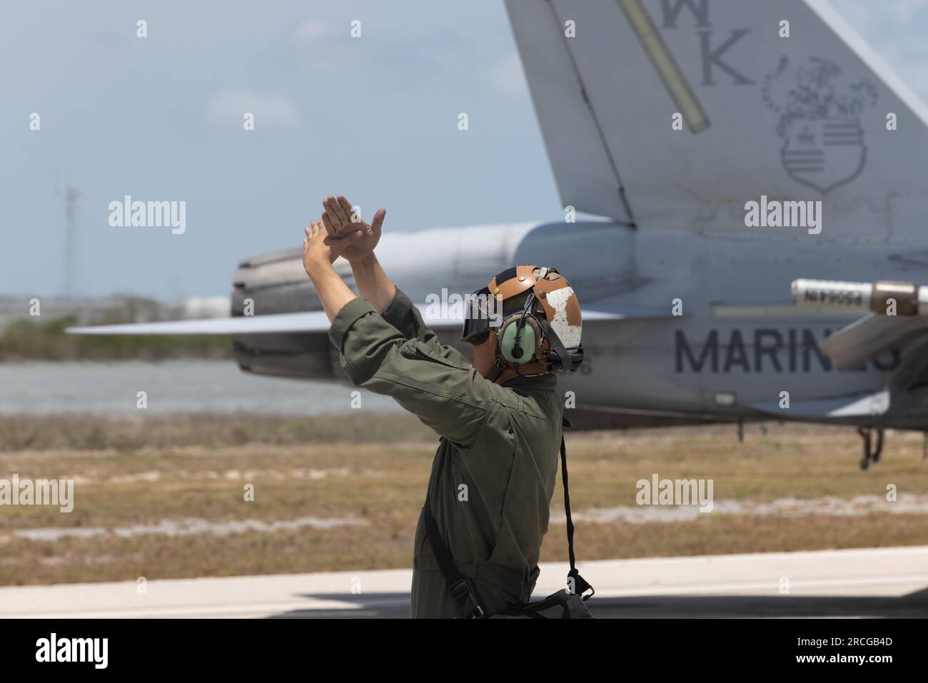 A U.S. Marine with Marine All Weather Fighter Attack Squadron (VMFA(AW ...