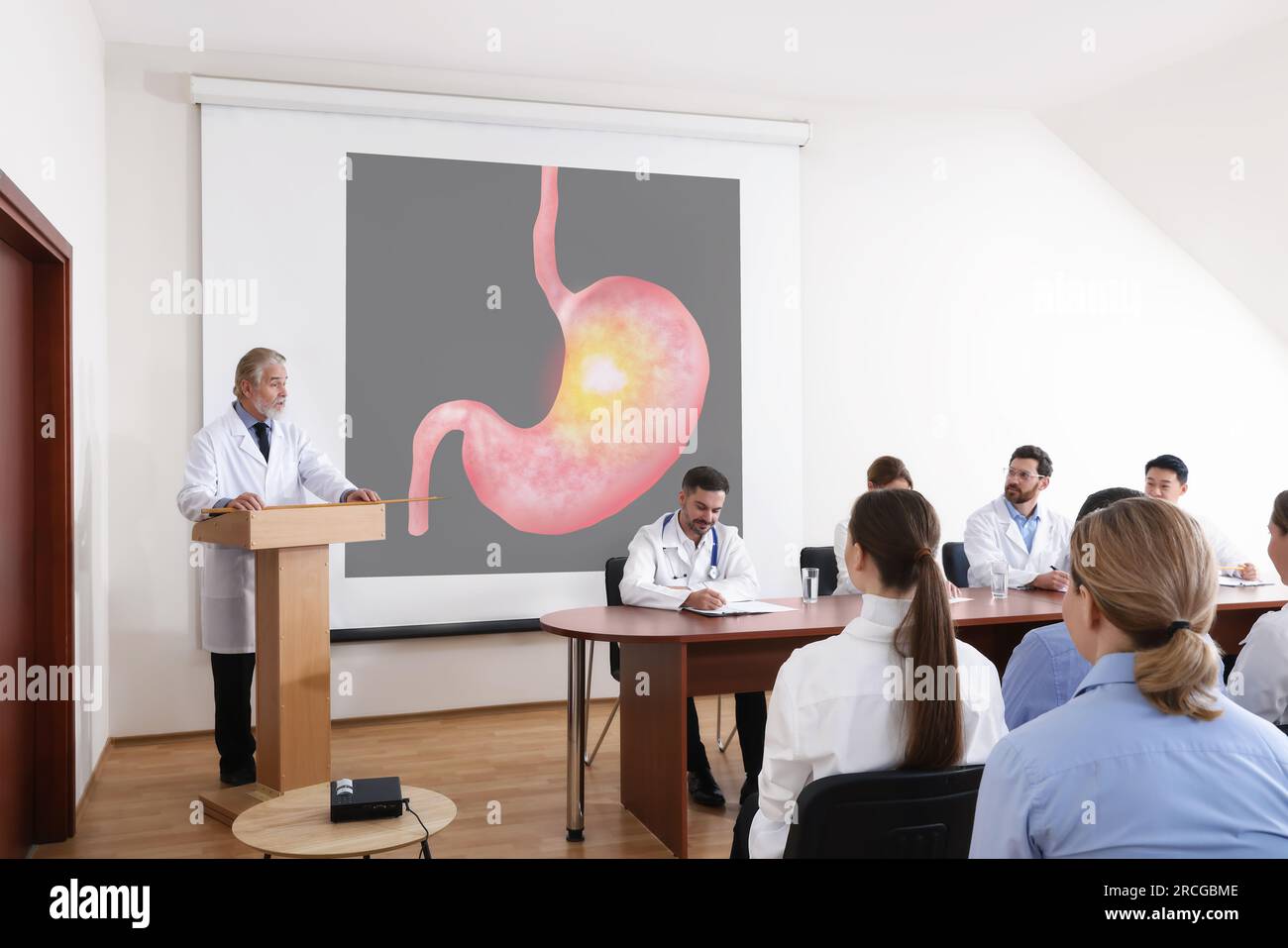 Lecture in gastroenterology. Conference room full of professors and ...