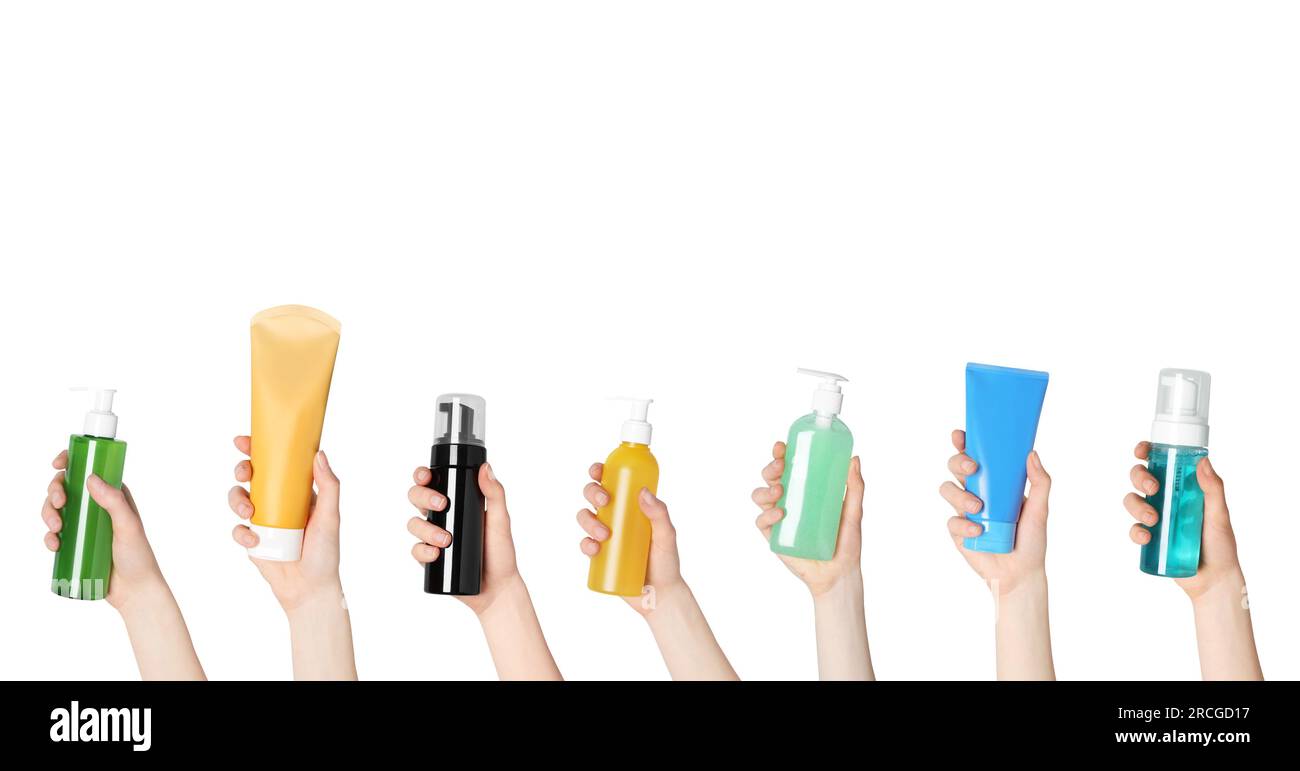 Face and body wash. Women holding bottles and tubes of different ...