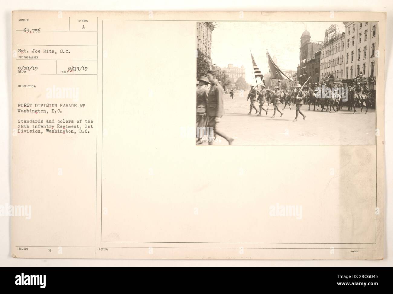 A photograph featuring a parade of the First Division in Washington, D ...