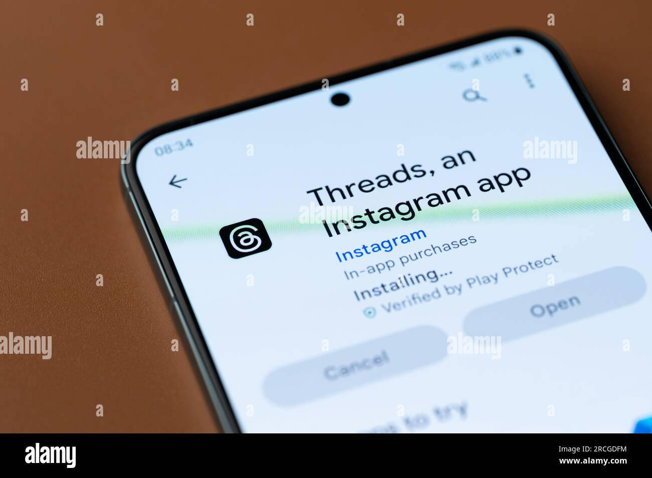 New York, USA - July 7, 2023: Installing threads instagram app on smartphone screen close up ...