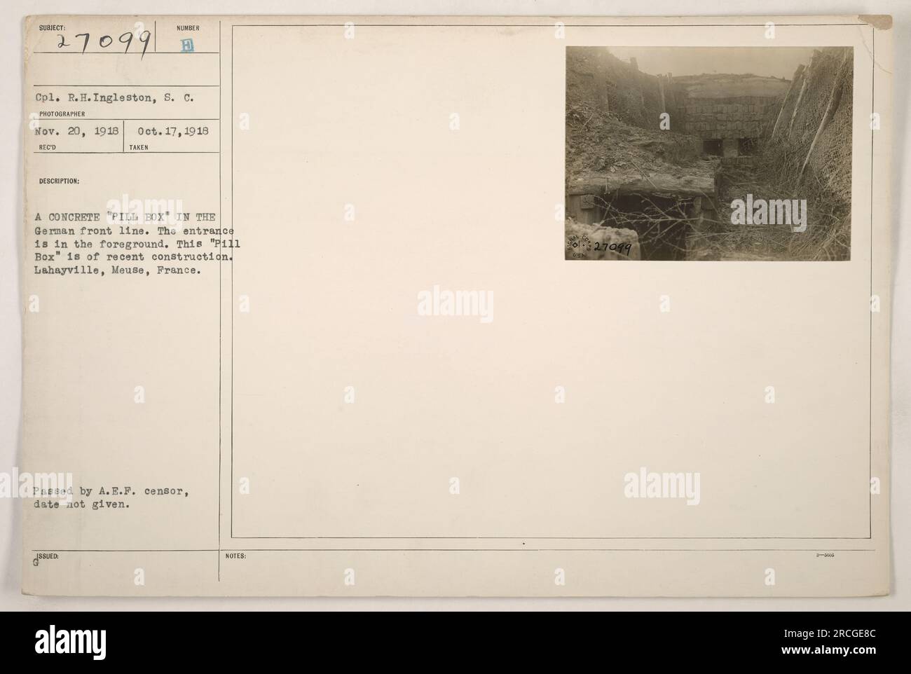 Caption: Cpl. R.H.Ingleston captures a photograph of a recently ...