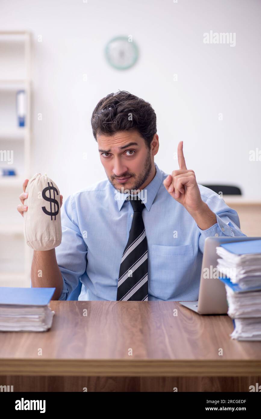 Young employee in remuneration concept Stock Photo - Alamy