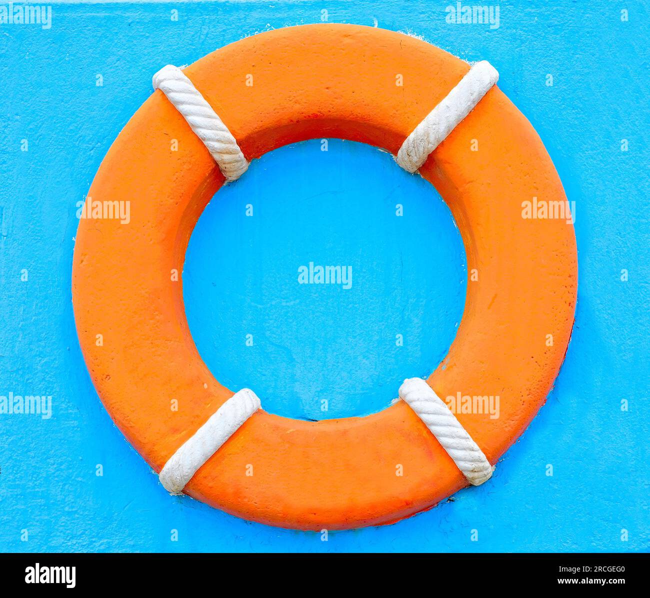 Orange lifebuoy or lifering buoyancy equipment designed to save lives of drowning victims, blue ...