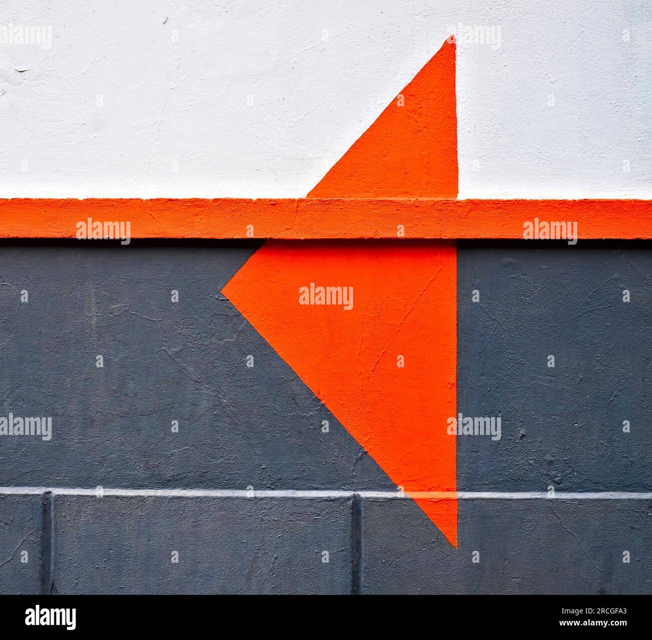 Orange triangle arrowhead and an orange line sign on white and dark ...