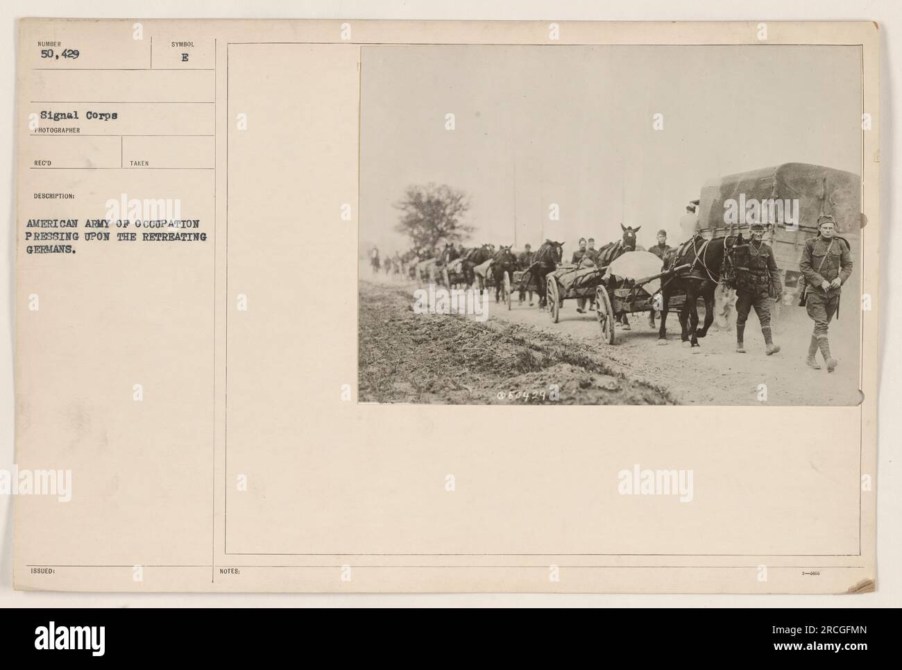 American soldiers advancing towards retreating German forces during ...