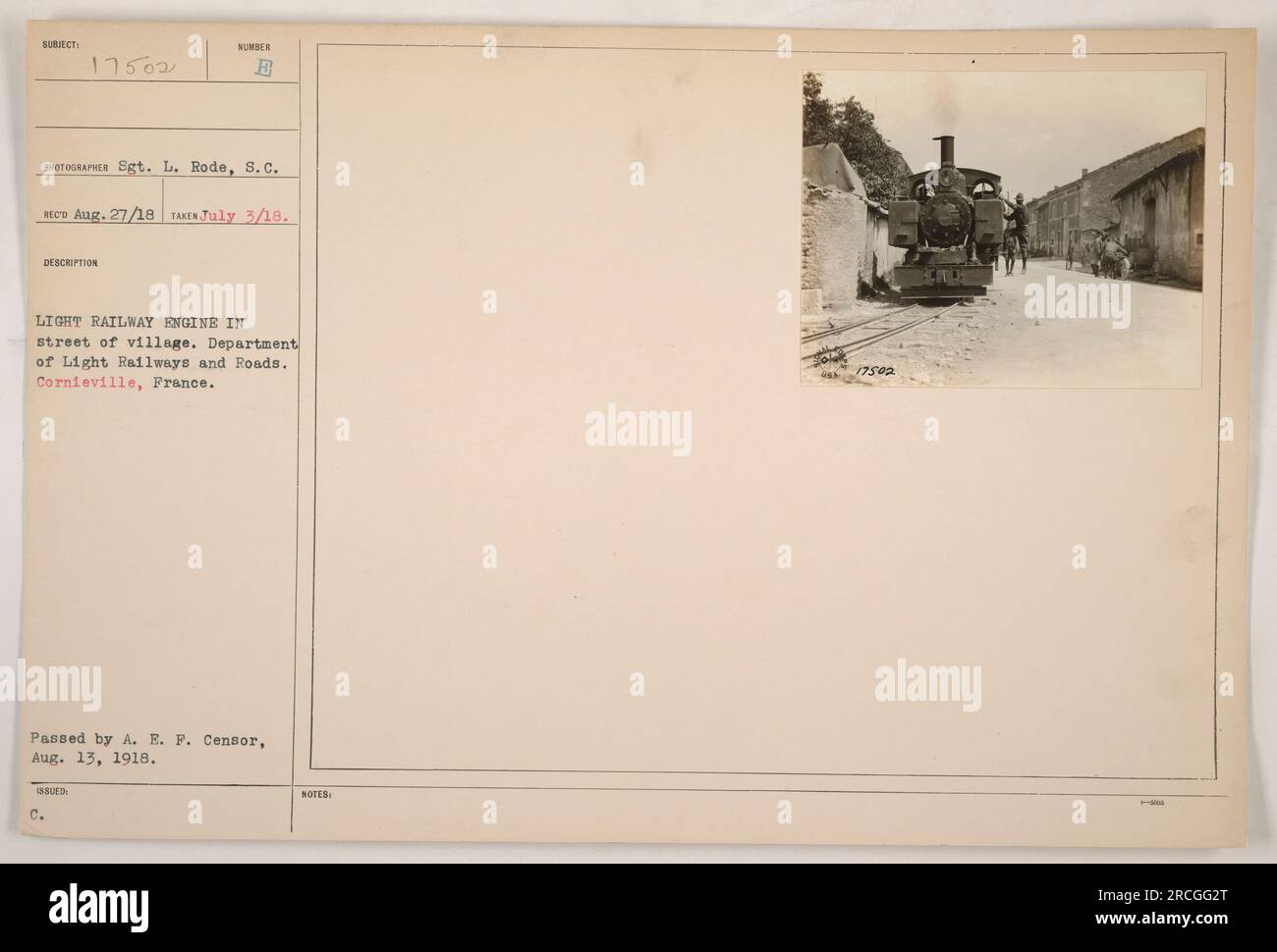 A light railway engine parked in the street of a village in Cornieville ...