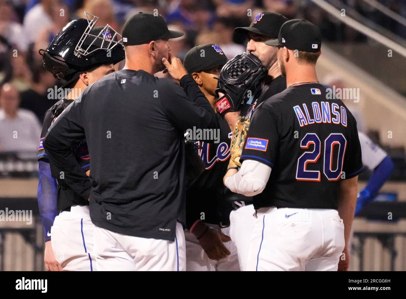 New York Mets pitching coach Jeremy Hefner, second from left, has a ...