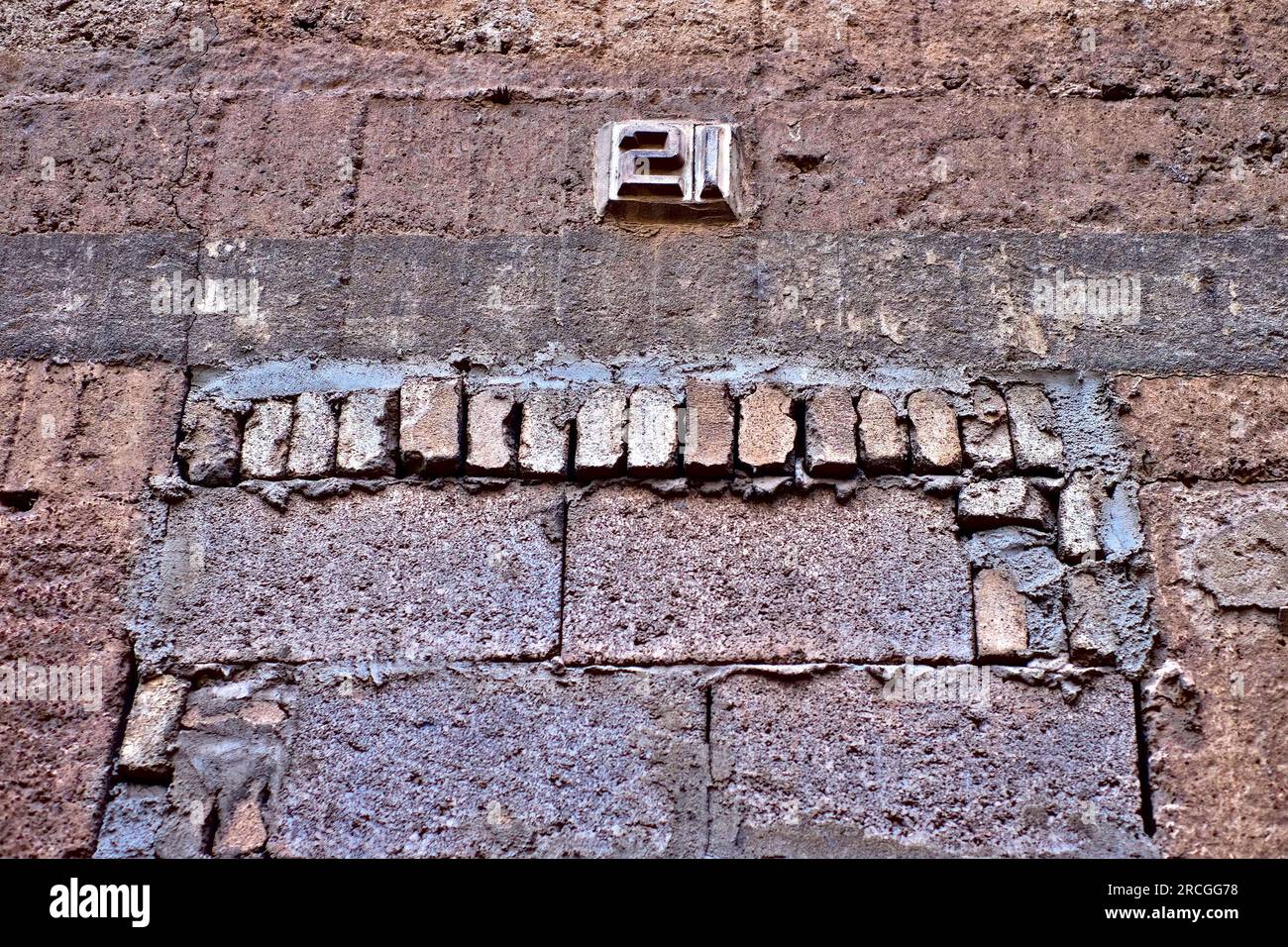 21, number twenty-one above door to an abandoned decaying building ...