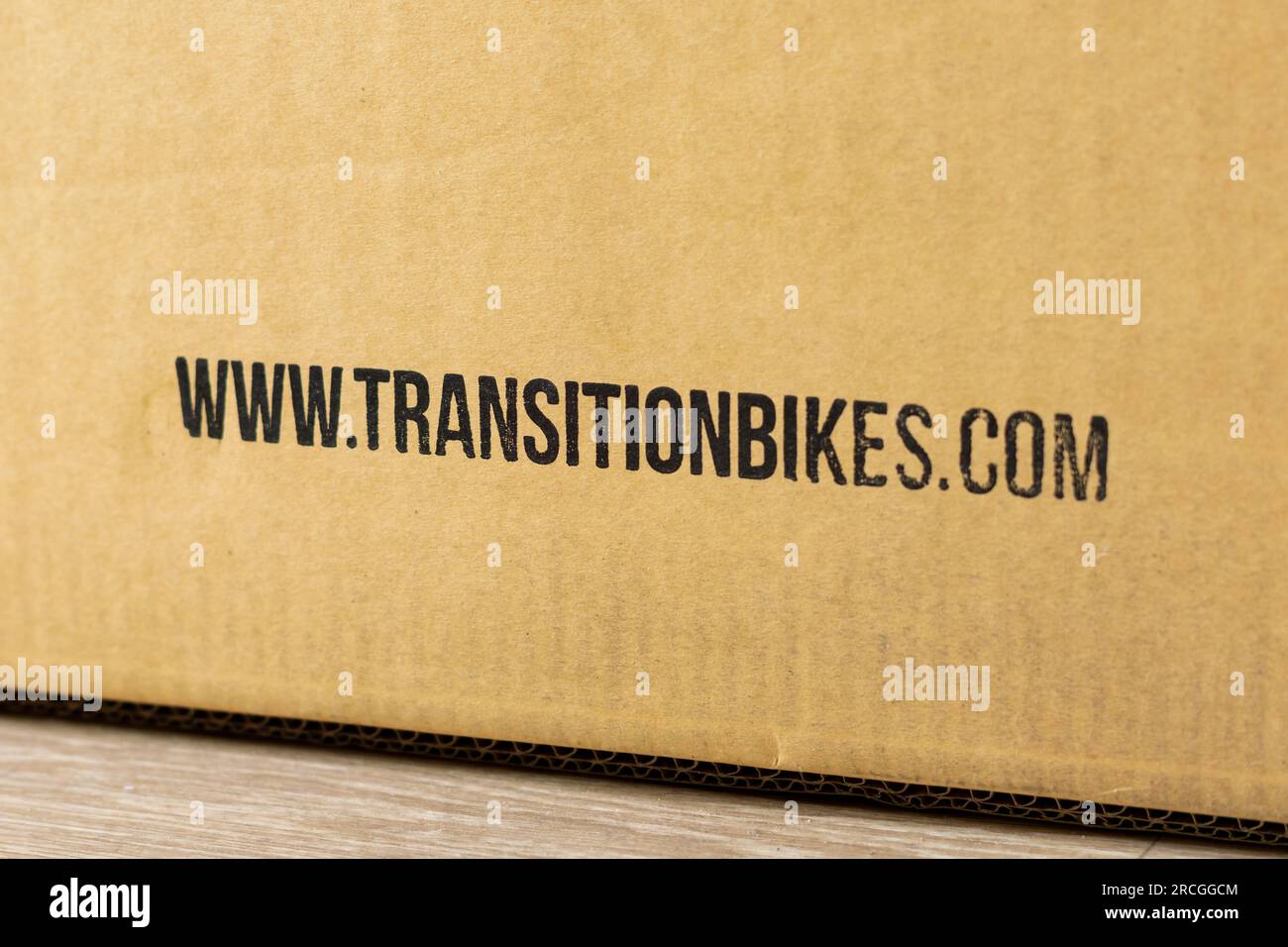 Parcel with the url of Transition Bikes printed on the exterior. Cardboard package when buying a ...