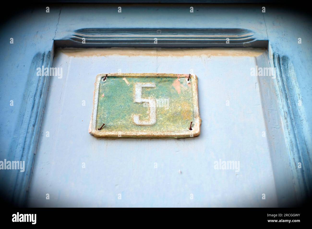 Old door with plate number 5, five, vignette effect Stock Photo - Alamy