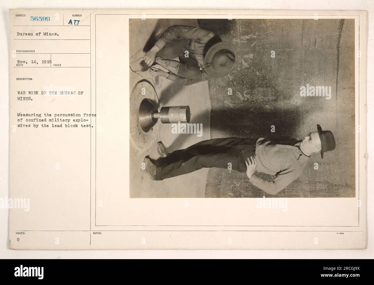 A photograph showing a technician from the Bureau of Mines measuring ...