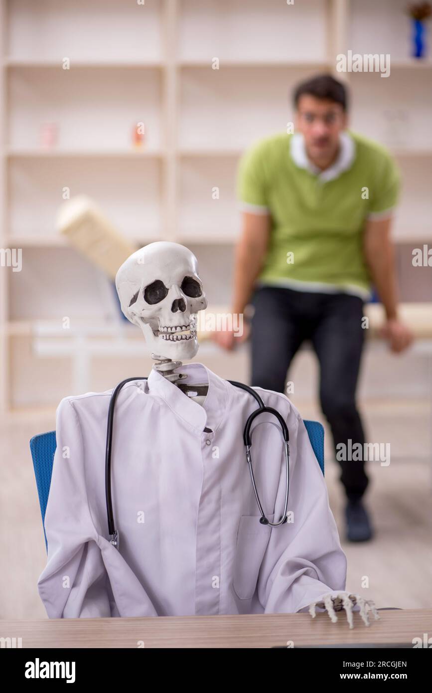 Young patient visiting skeleton doctor Stock Photo - Alamy