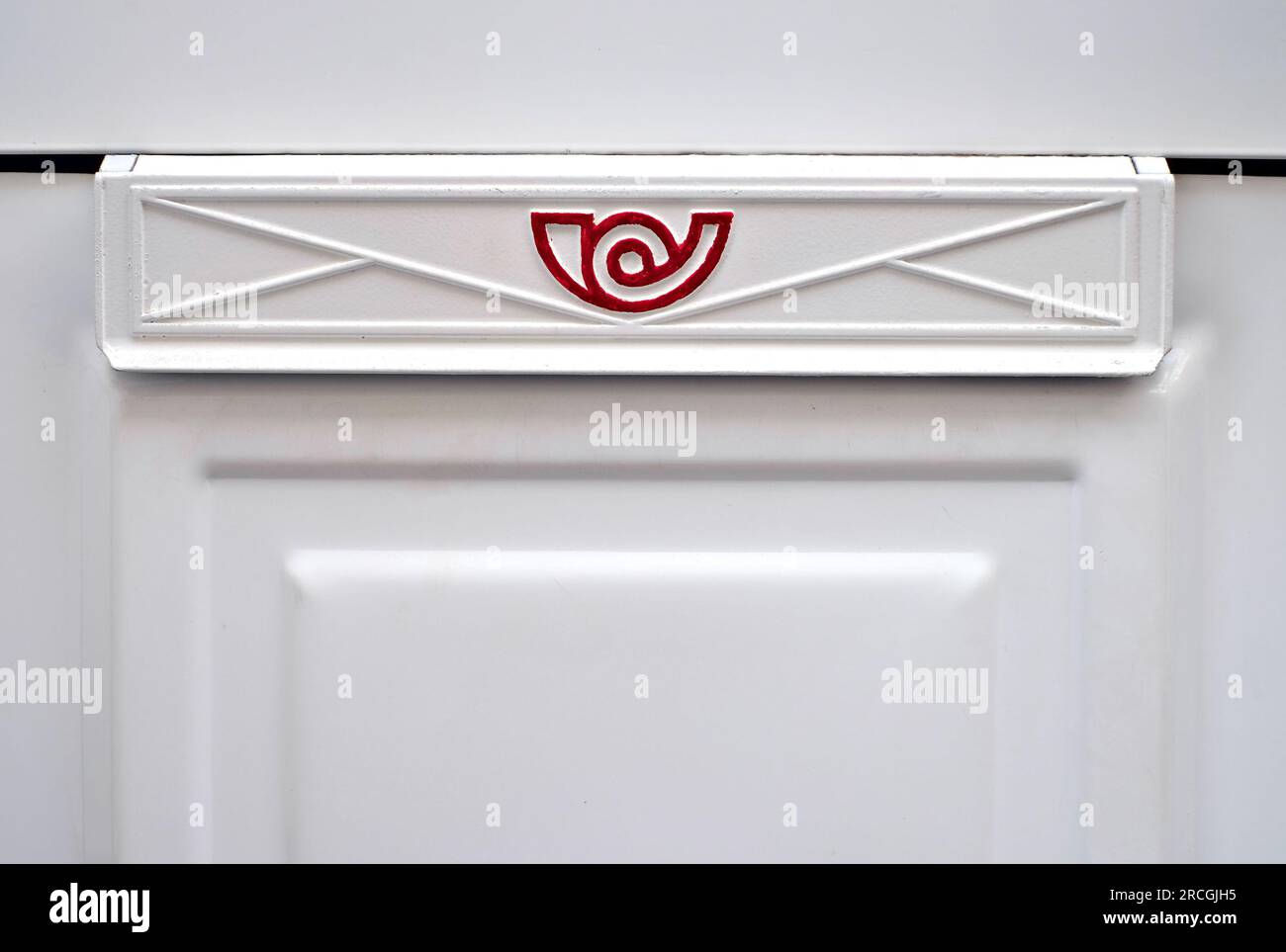 Perfect white letter box on perfect white door, with a red post office ...