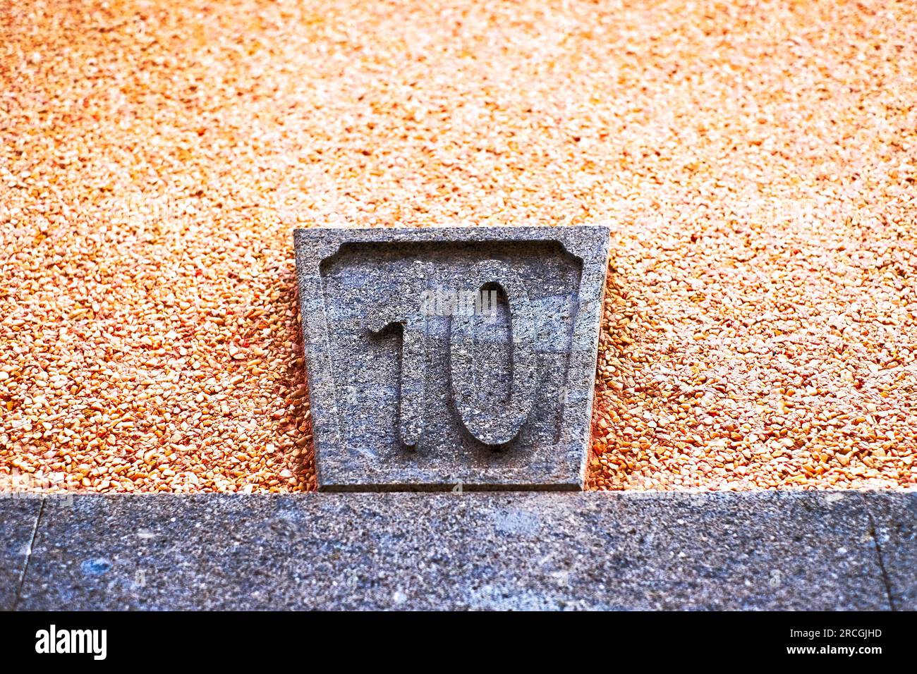 Number 10, ten, gray stone number on pebble dashed warm surface Stock ...