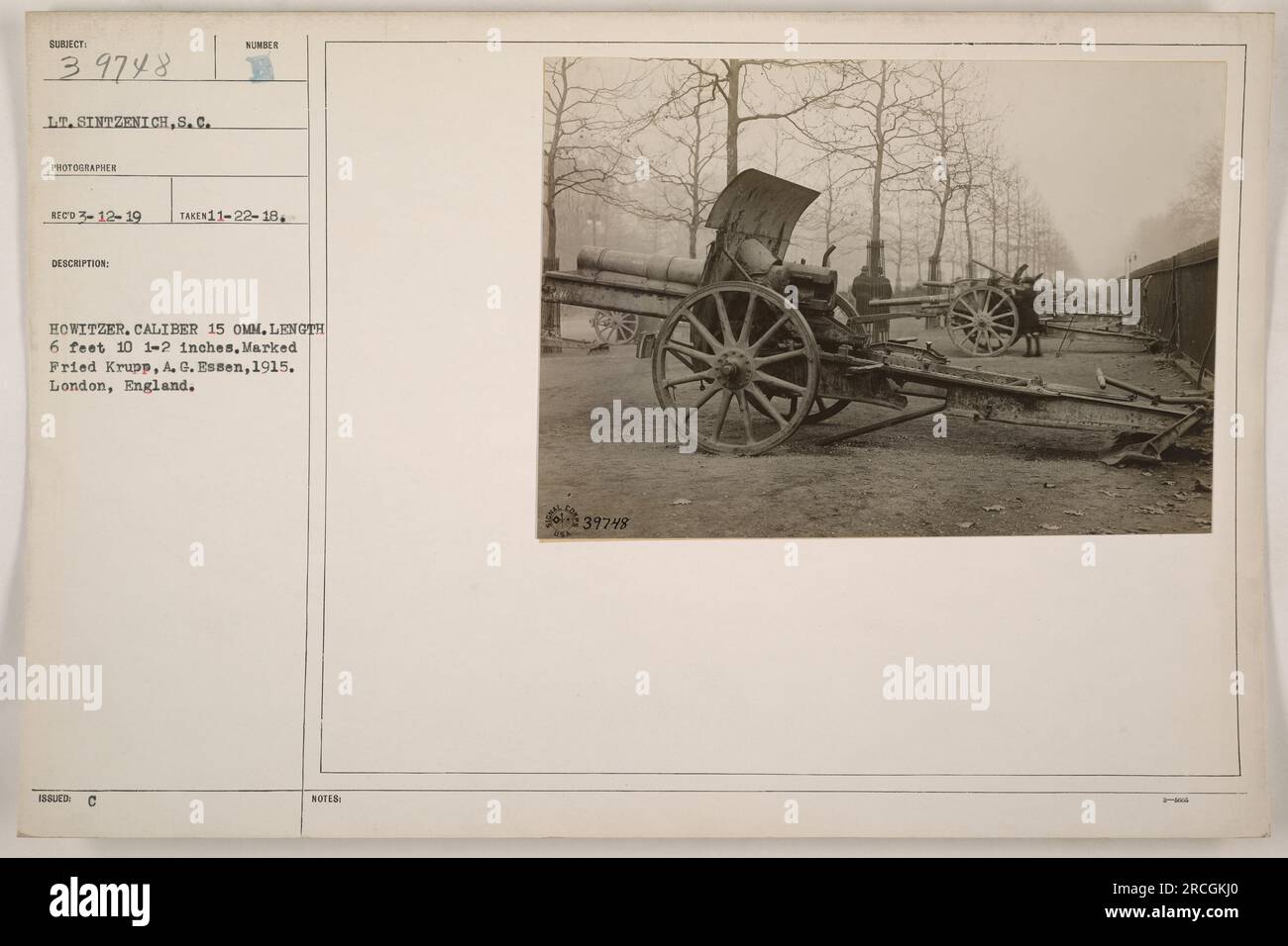 A black and white photograph showing a number howitzer from World War ...